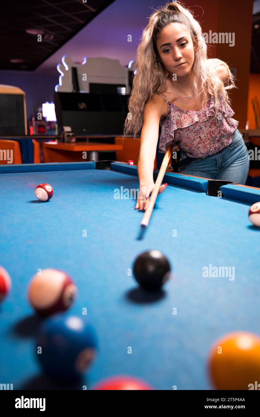 Front view woman playing billiard Stock Photo - Alamy