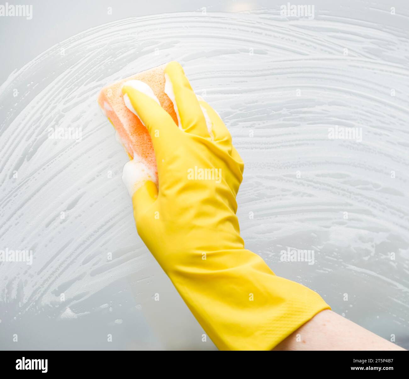 Front view window cleaning with sponge Stock Photo - Alamy