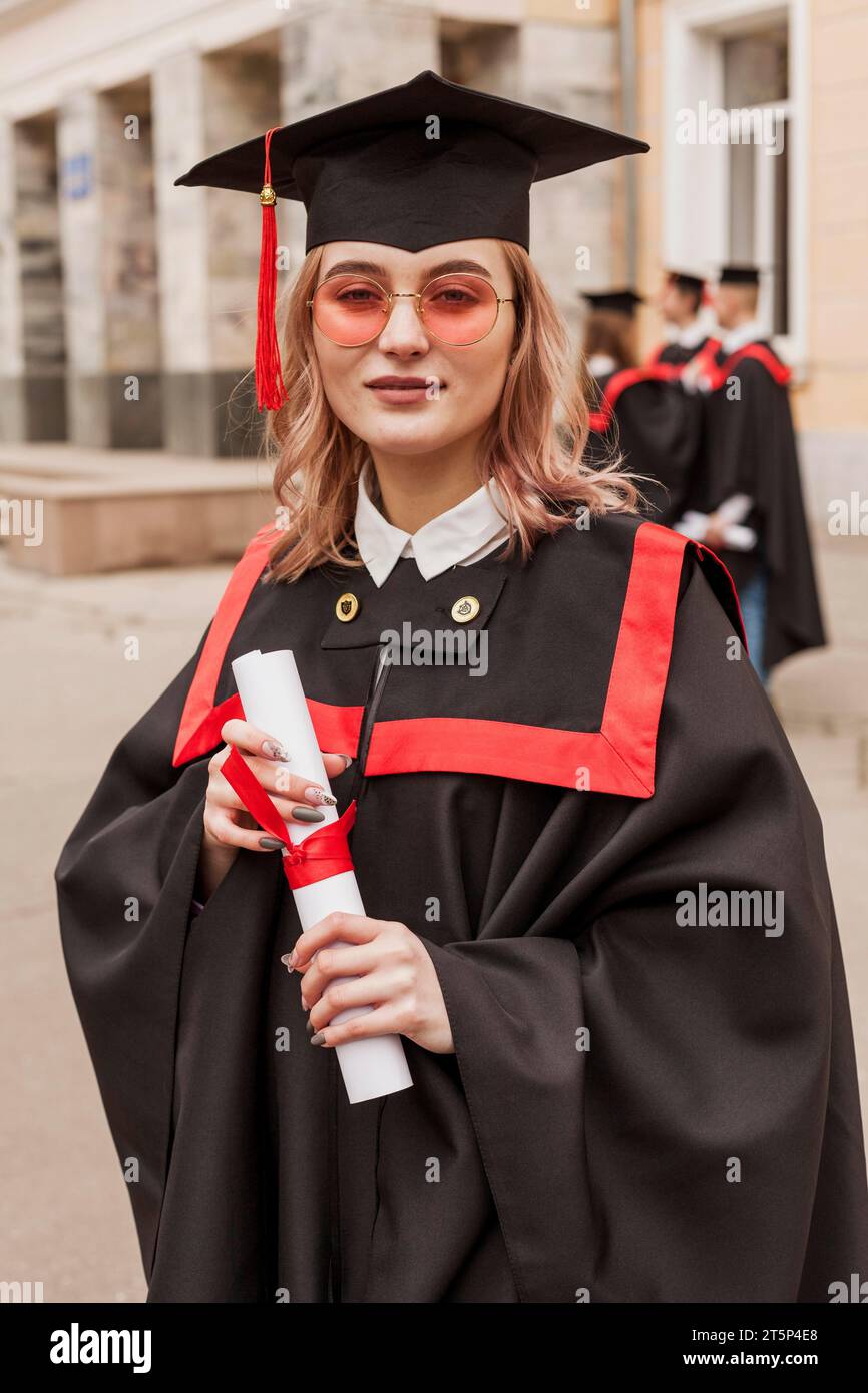 Girl graduation with diploma Stock Photo - Alamy