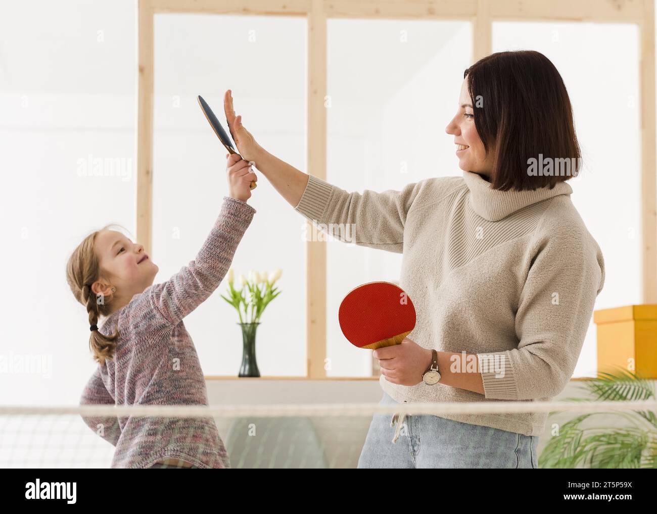 Mom child giving high five Stock Photo - Alamy