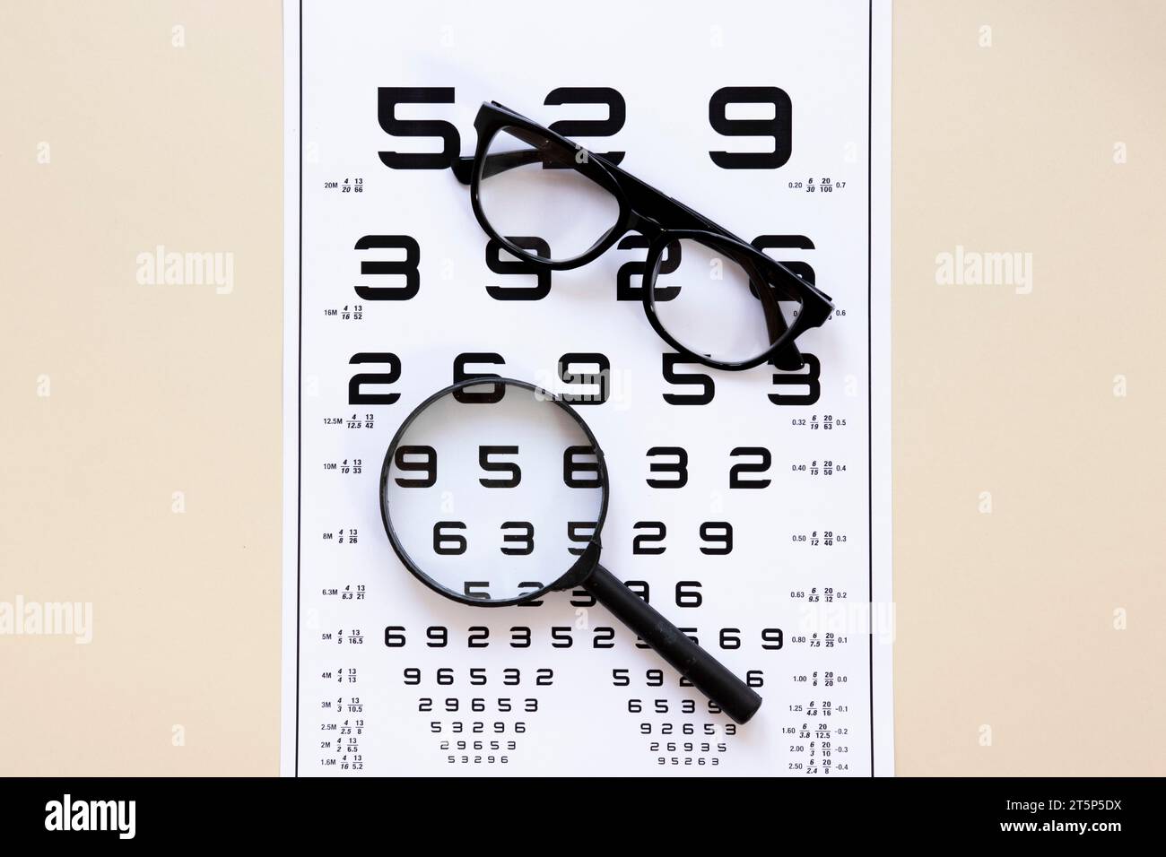 Numbers table with glasses magnifier Stock Photo - Alamy