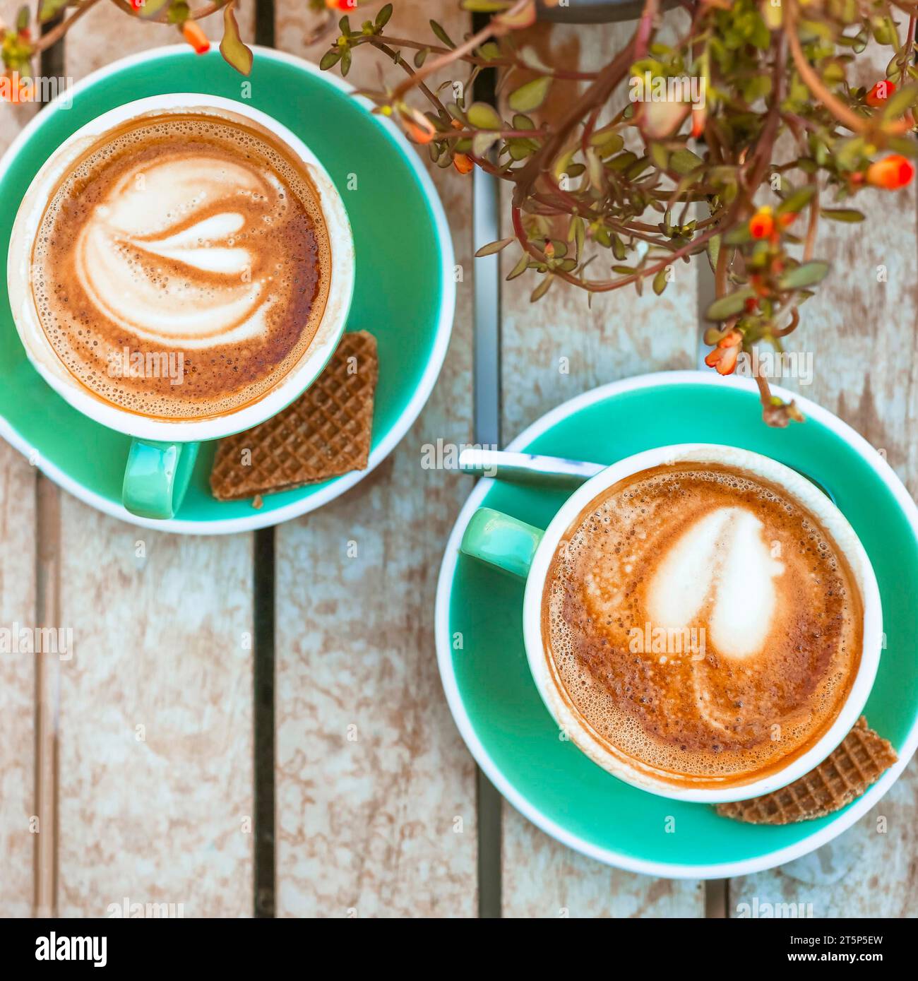 Overhead view two coffee cup with heart shape latte art Stock Photo - Alamy