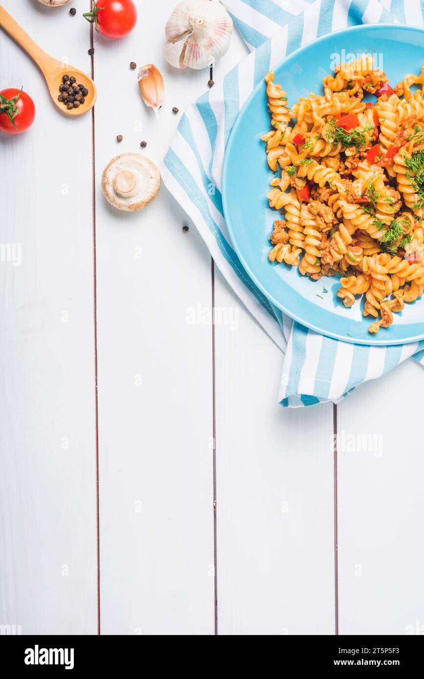 Overhead view homemade fusilli pasta with ingredients wooden table ...