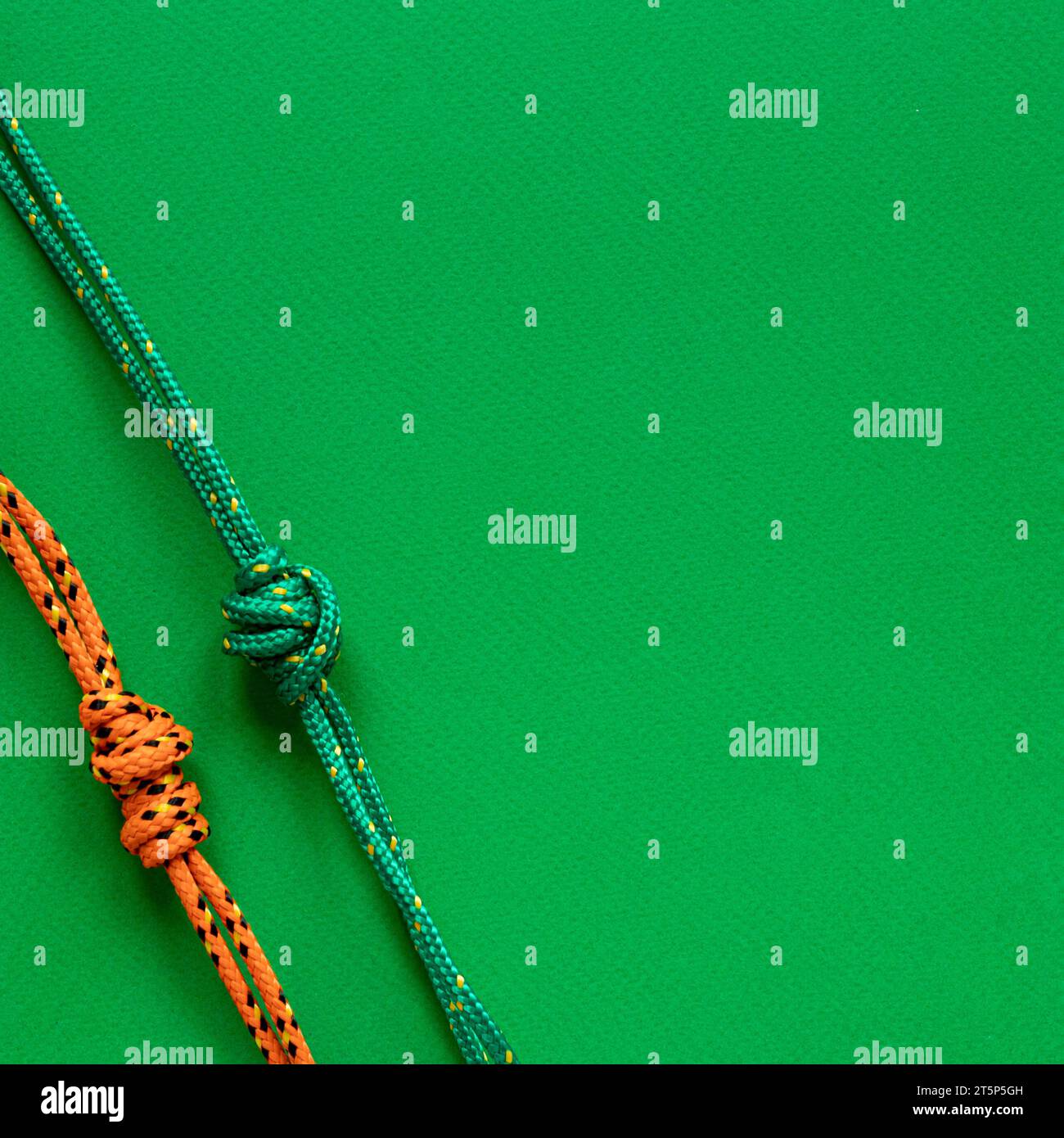 Nautical rope knots copy space green background Stock Photo - Alamy