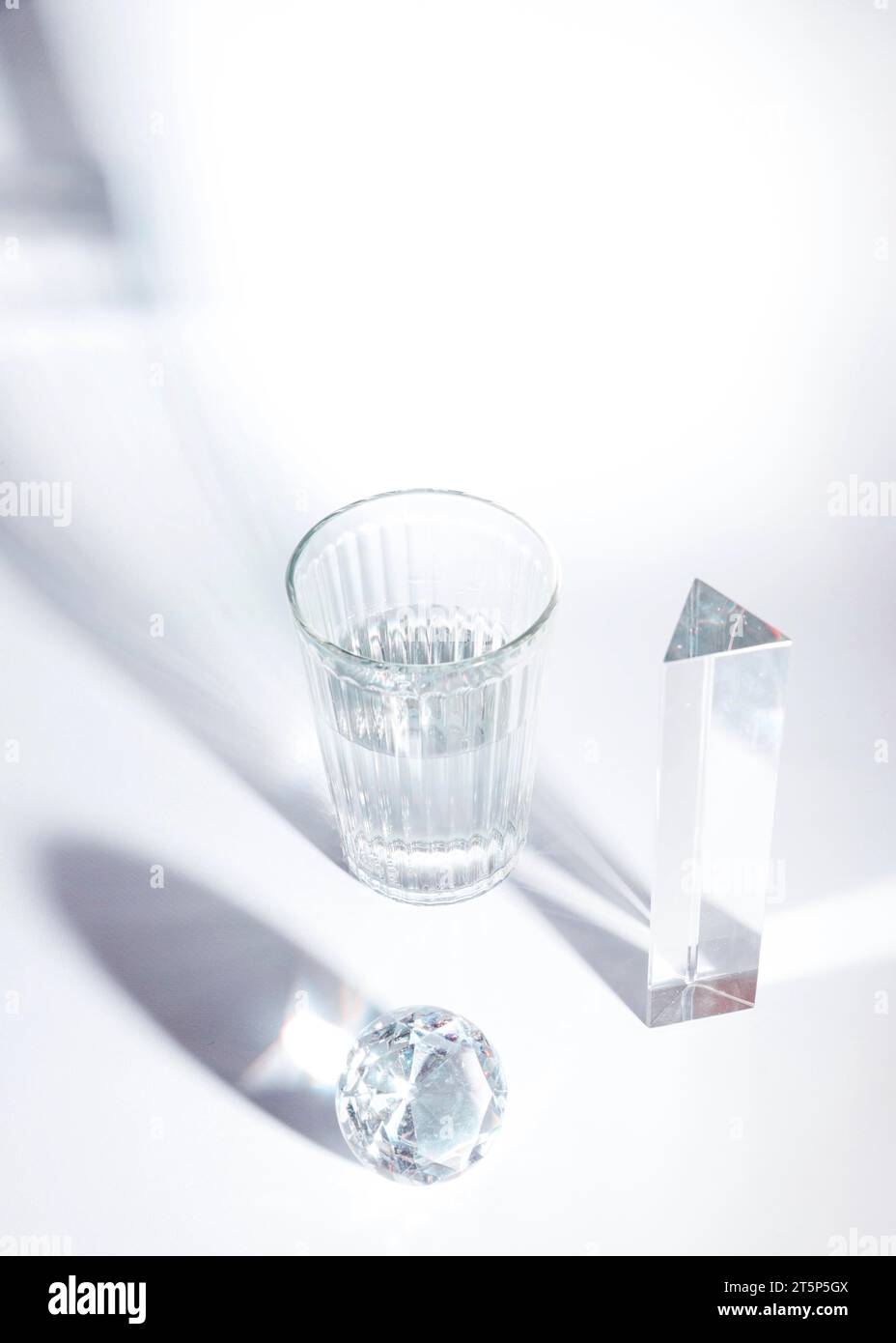 Overhead view shiny diamond prism glass with shadow white background ...