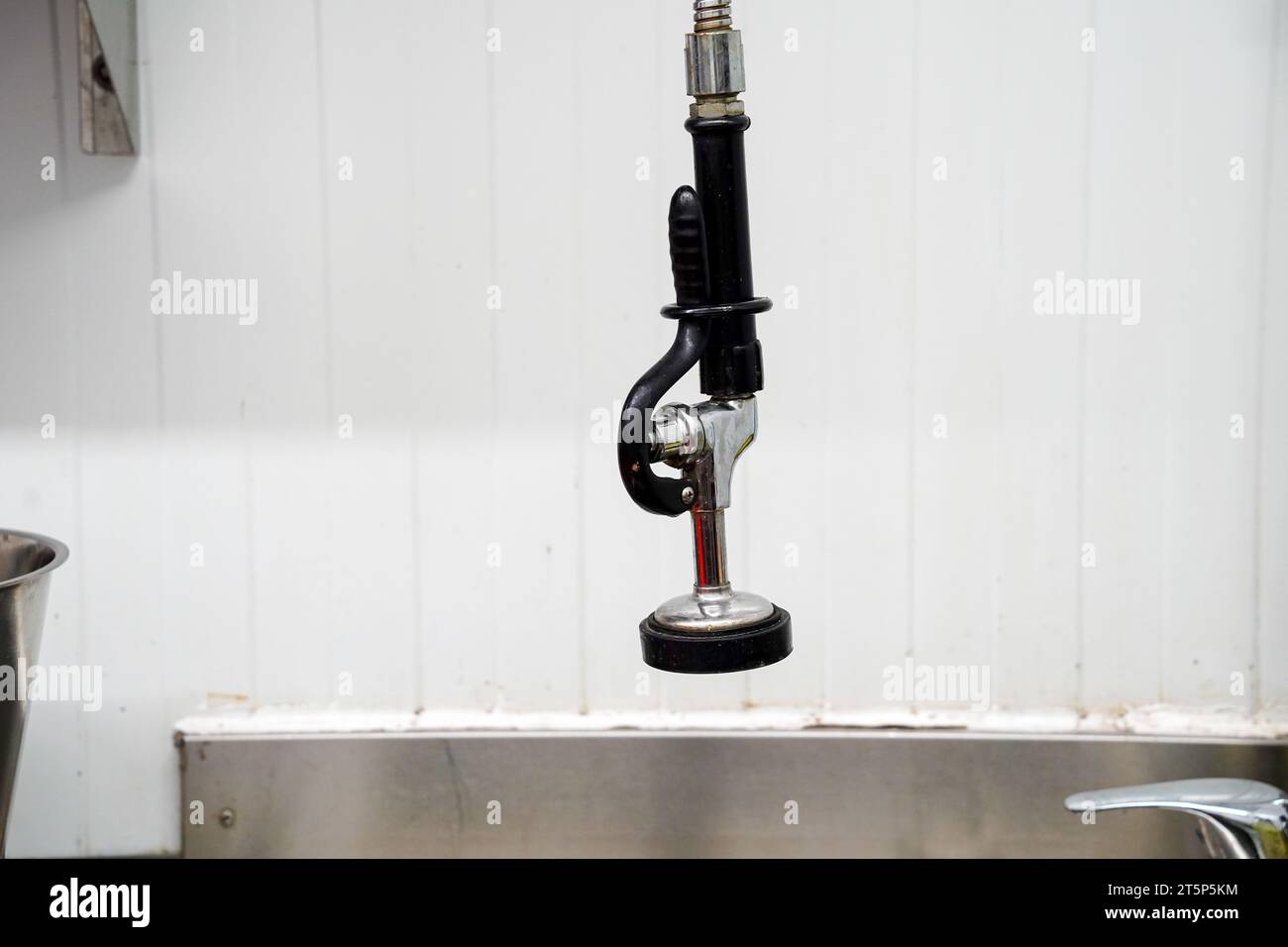 water faucet for washing up in an industrial kitchen. hanging water ...