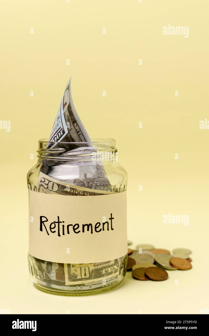 Retirement label jar filled with money front view Stock Photo - Alamy