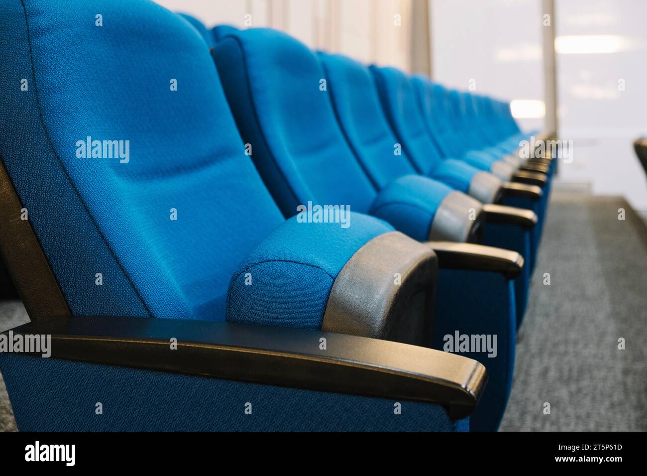 Row cushioned seats Stock Photo - Alamy