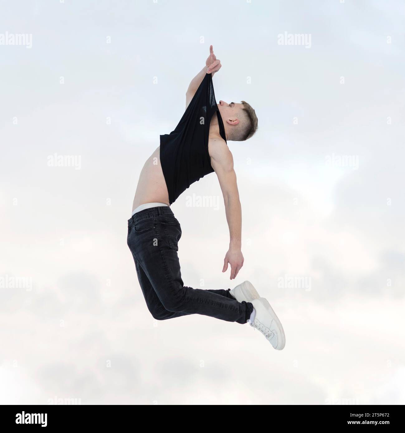 Side view mid air pose by hip hop dancer Stock Photo - Alamy