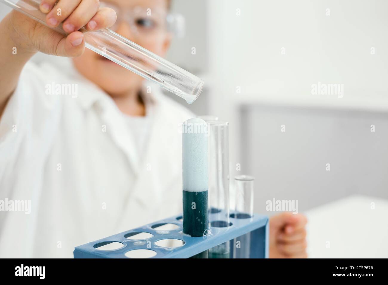 Smiley boy scientist laboratory with test tubes experimenting Stock ...