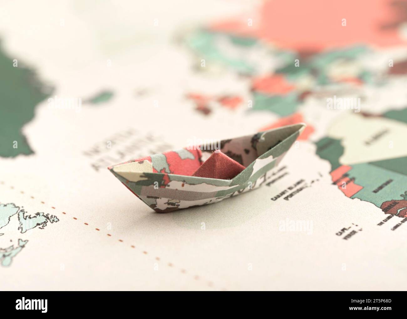 Small origami boat world map Stock Photo - Alamy