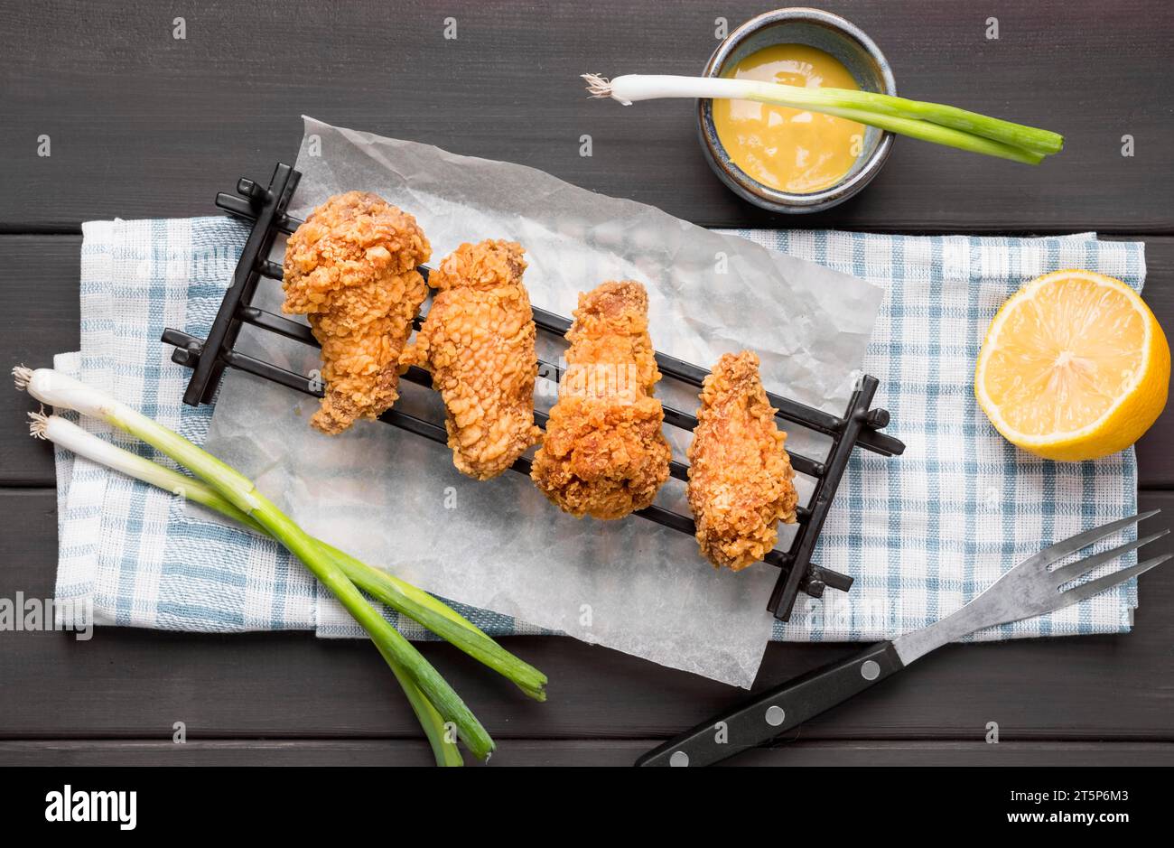 Top view fried chicken wings tray with green onions lemon Stock Photo ...