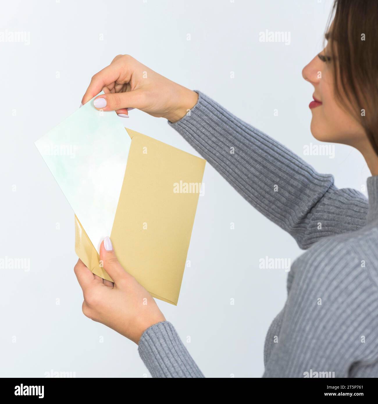 Woman envelope paper holding hi-res stock photography and images - Alamy