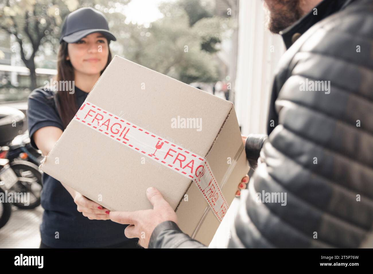Female courier delivering hi-res stock photography and images - Alamy