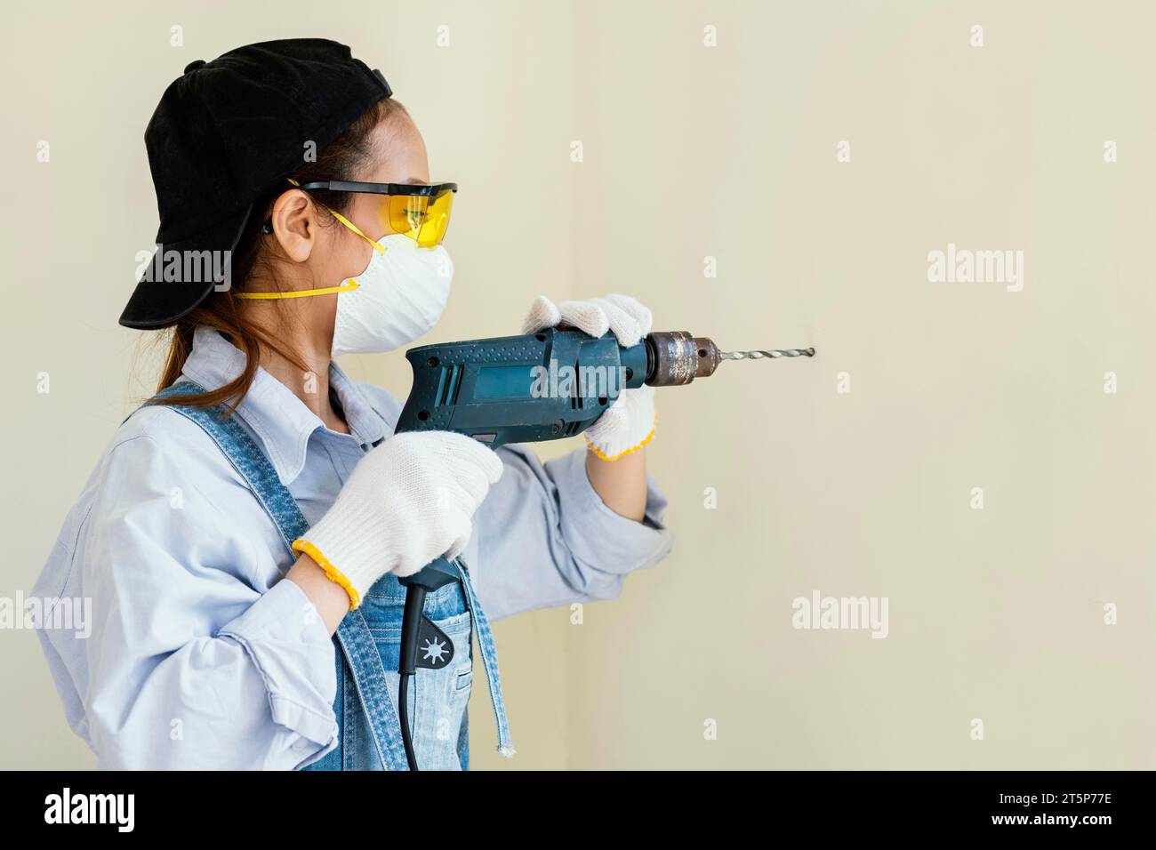 Woman with safety protection equipment working Stock Photo - Alamy