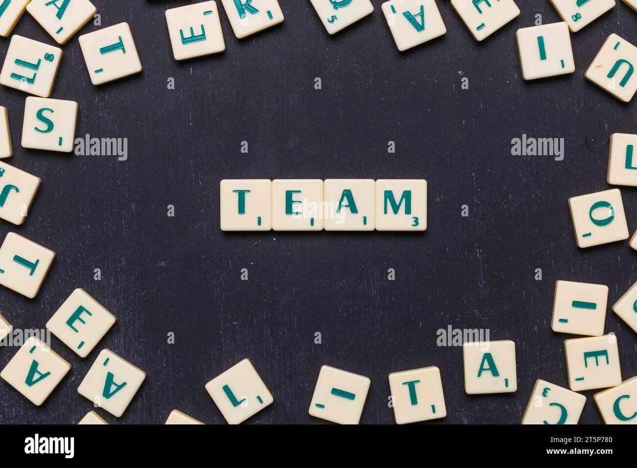 Word team scrabble letters black backdrop Stock Photo - Alamy