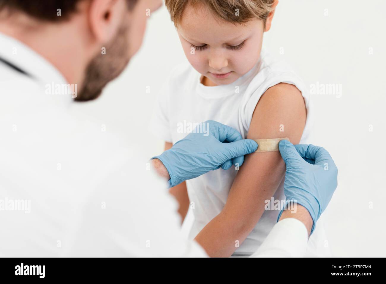 Close up doctor putting patch Stock Photo - Alamy
