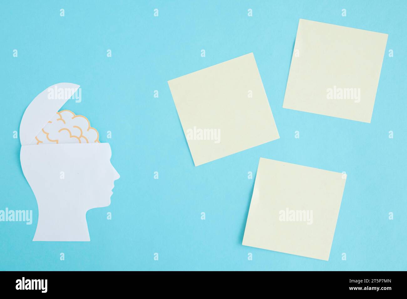 Blank sticky notes with brain open head blue background Stock Photo - Alamy