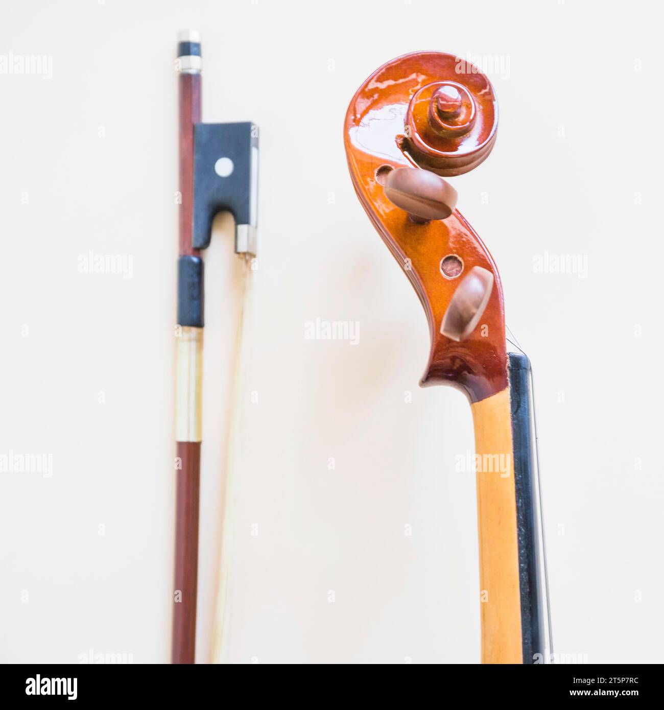 Classical musical violin bow against white background Stock Photo - Alamy