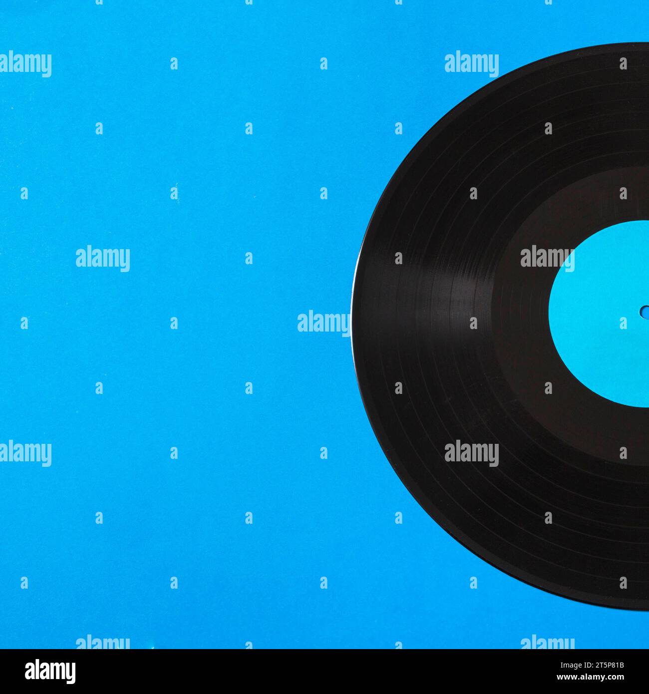 Close up vinyl record blue background Stock Photo - Alamy