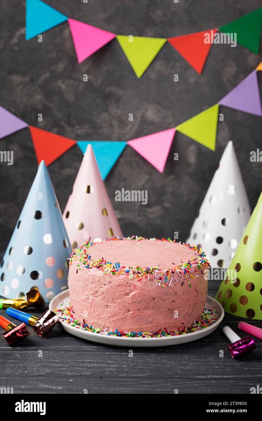Decoration with pink cake party hats Stock Photo - Alamy