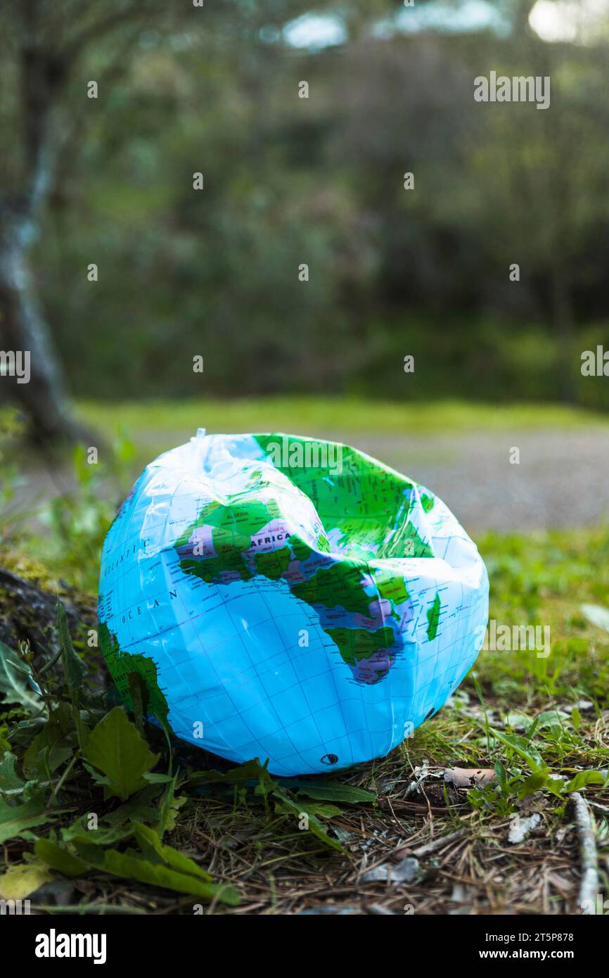 Destroyed globe laying ground Stock Photo - Alamy