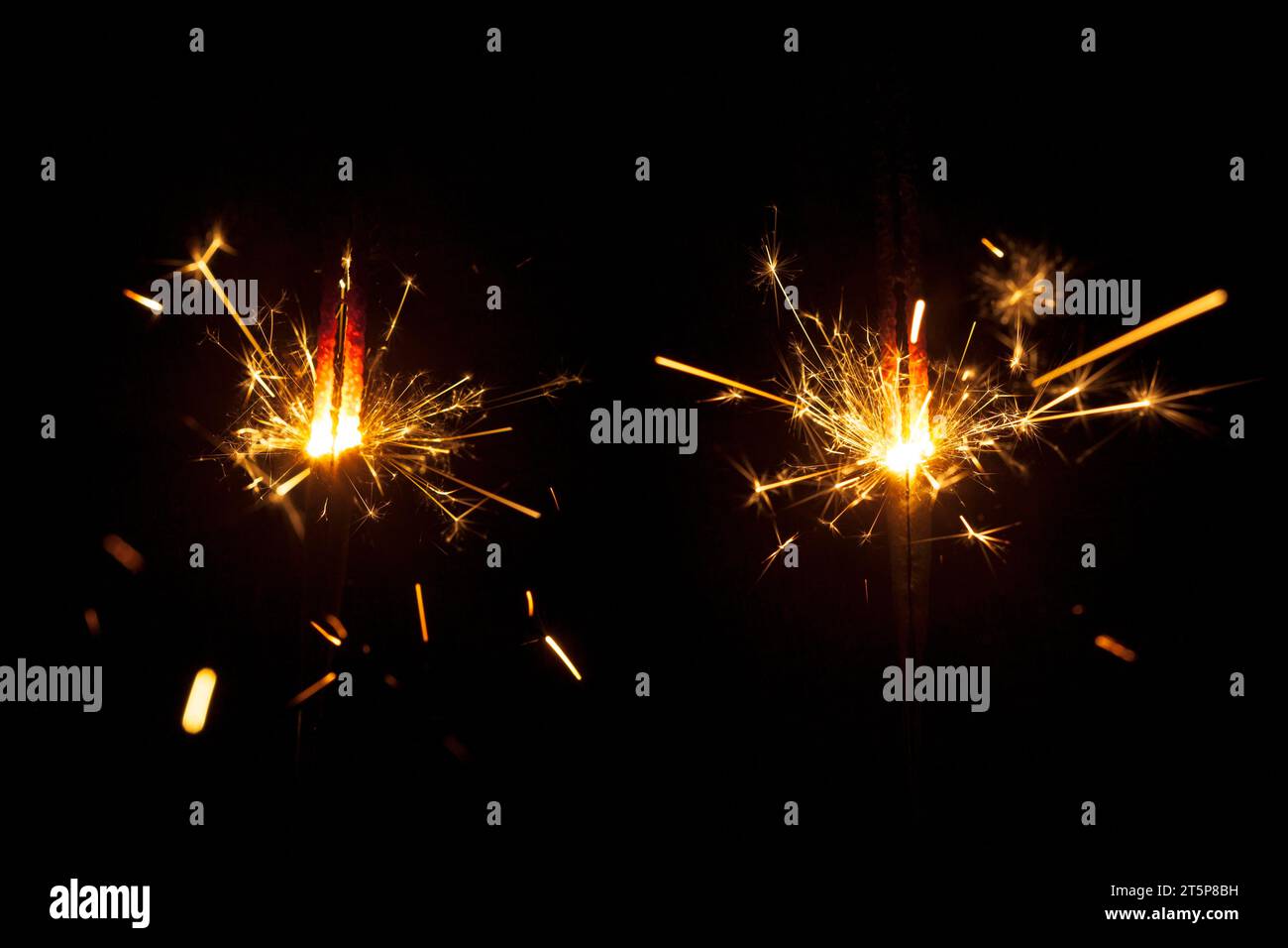 Fantastic burning sparklers dark background Stock Photo - Alamy