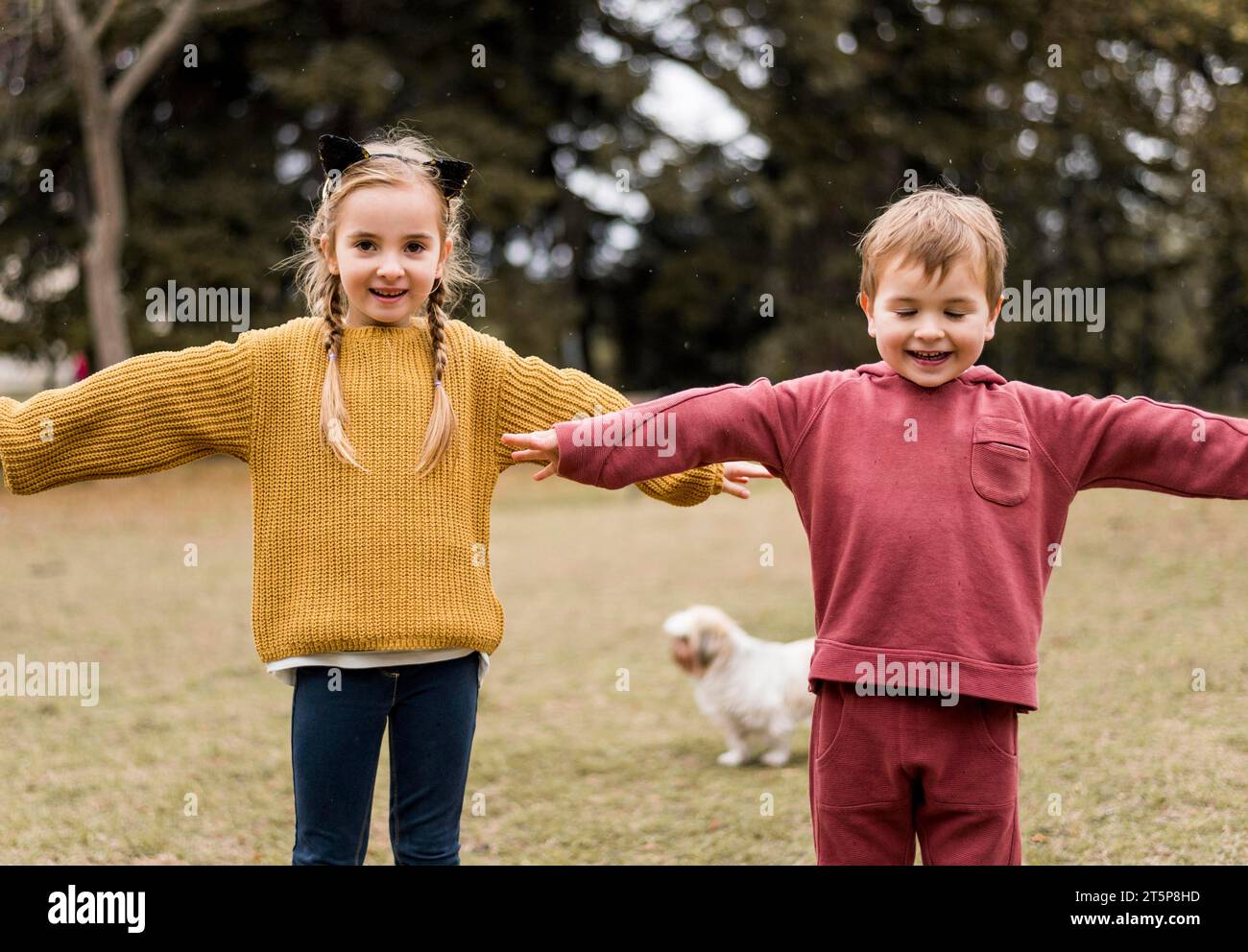 Front view smiley kids playing Stock Photo - Alamy