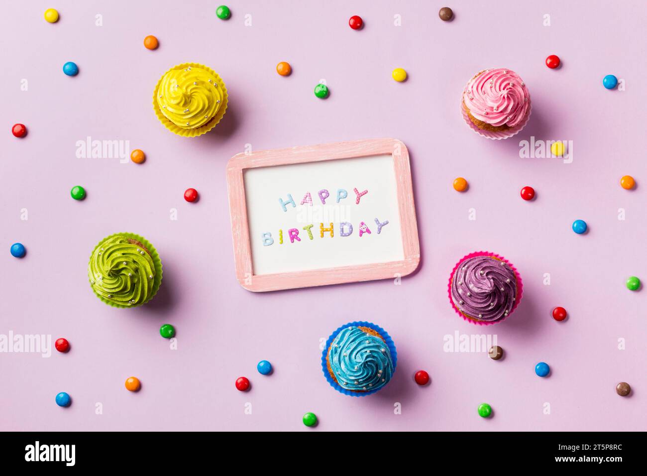 Happy birthday slate surrounded with colorful gems muffins pink ...