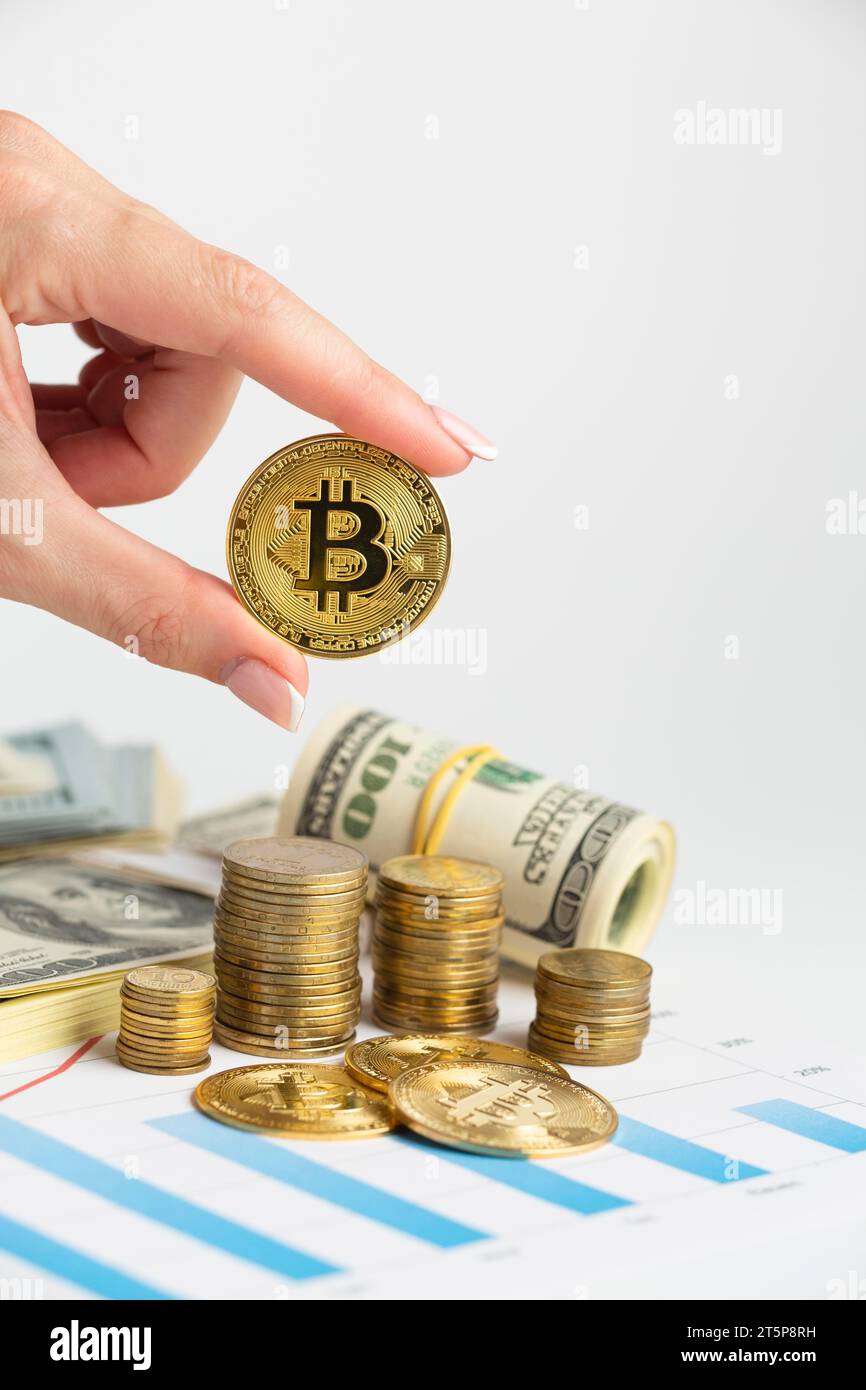 Hand holding bitcoin coin stack Stock Photo - Alamy