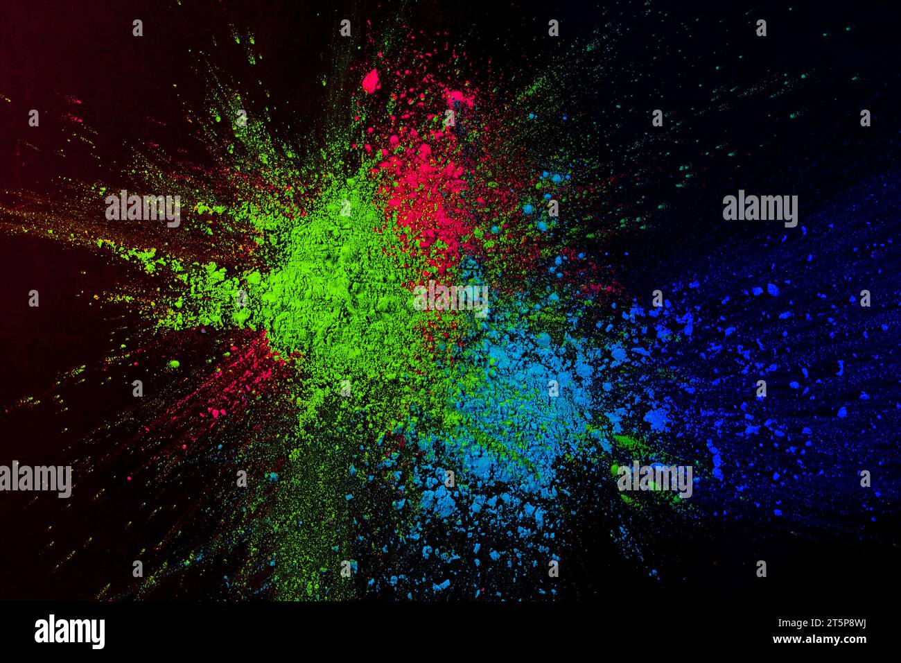 High colorful powder color splatted dark background Stock Photo - Alamy