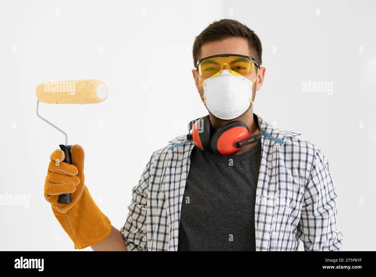 Man with safety protection equipment painting Stock Photo - Alamy
