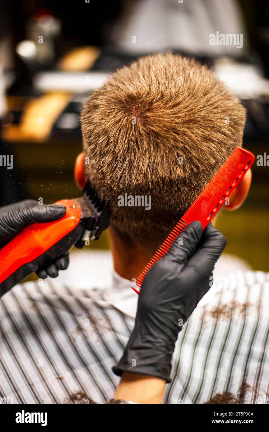 Man getting haircut hairdresser modern hi-res stock photography and ...