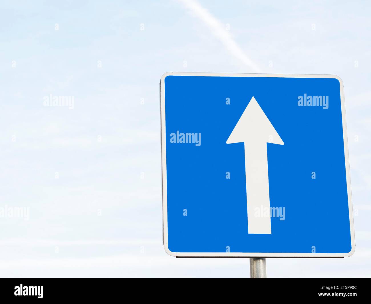 Low angle blue arrow sign Stock Photo - Alamy