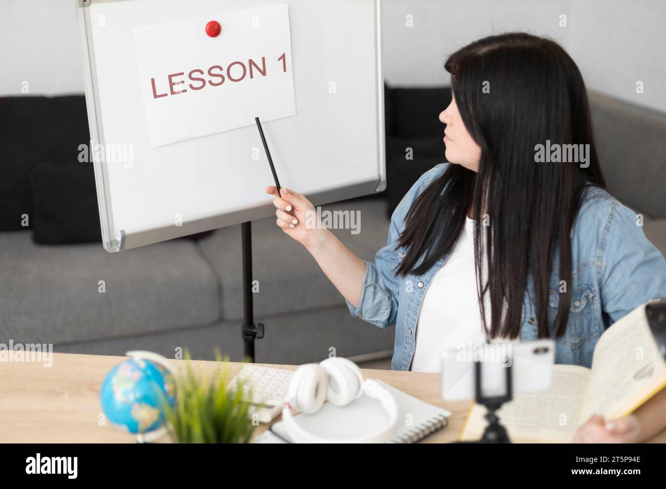Medium shot woman presenting lesson Stock Photo - Alamy