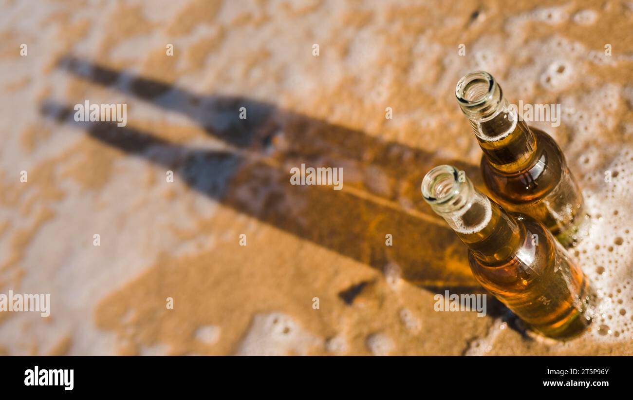 Overhead view open beer bottles with shadow shallow water beach Stock ...