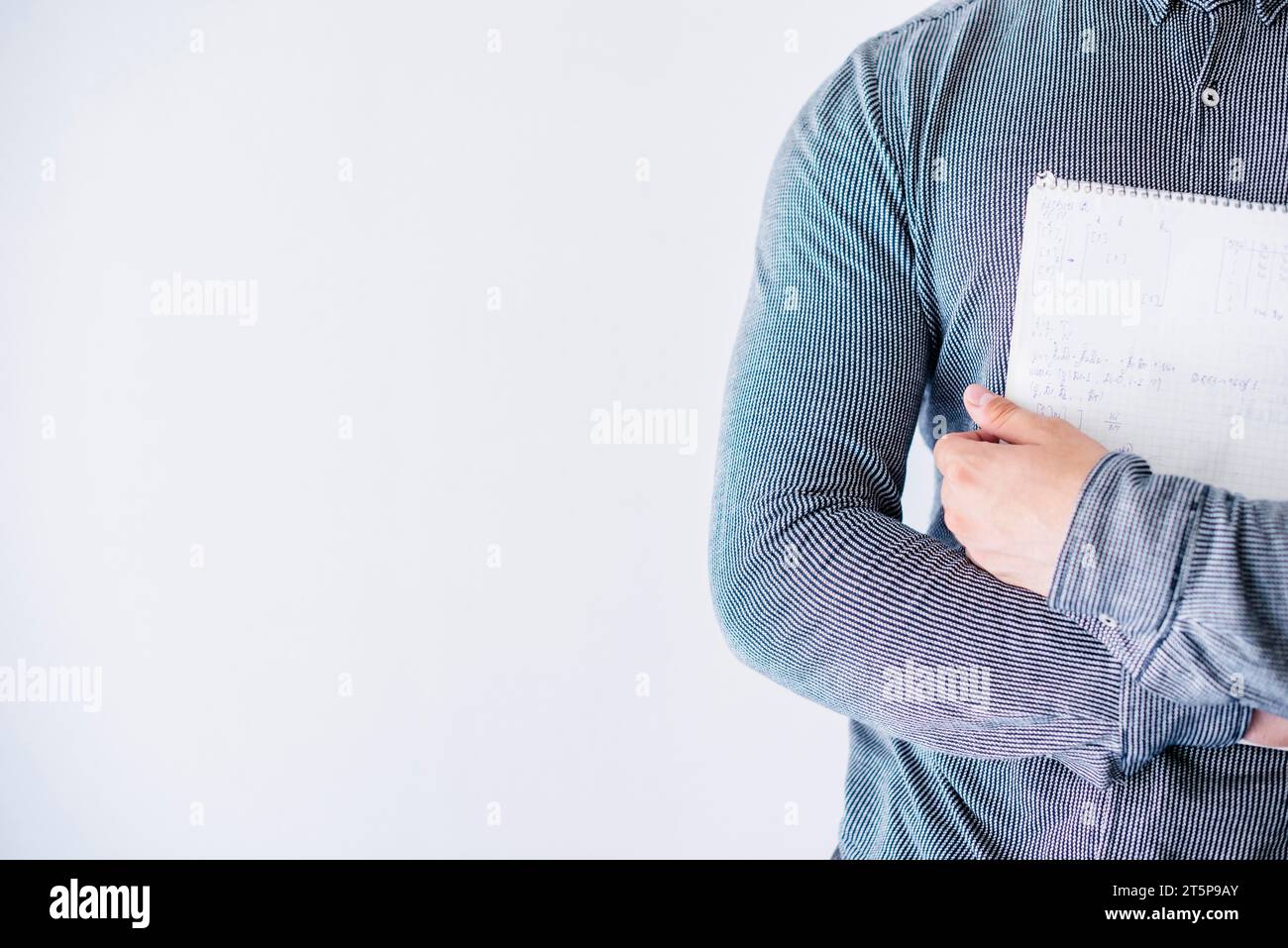 Person holding notebook studio Stock Photo - Alamy