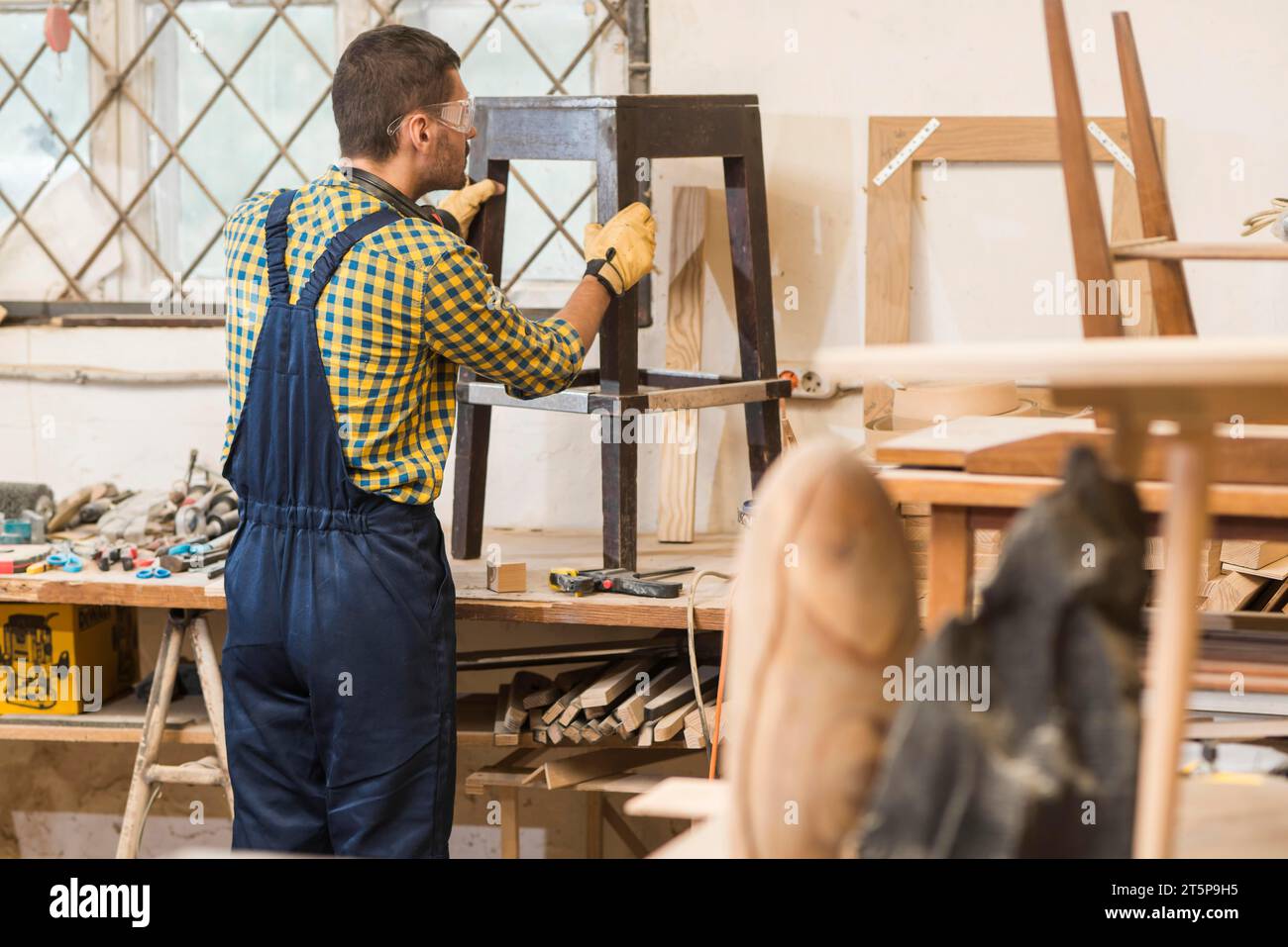 Side view male carpenter making wooden furniture workshop Stock Photo ...