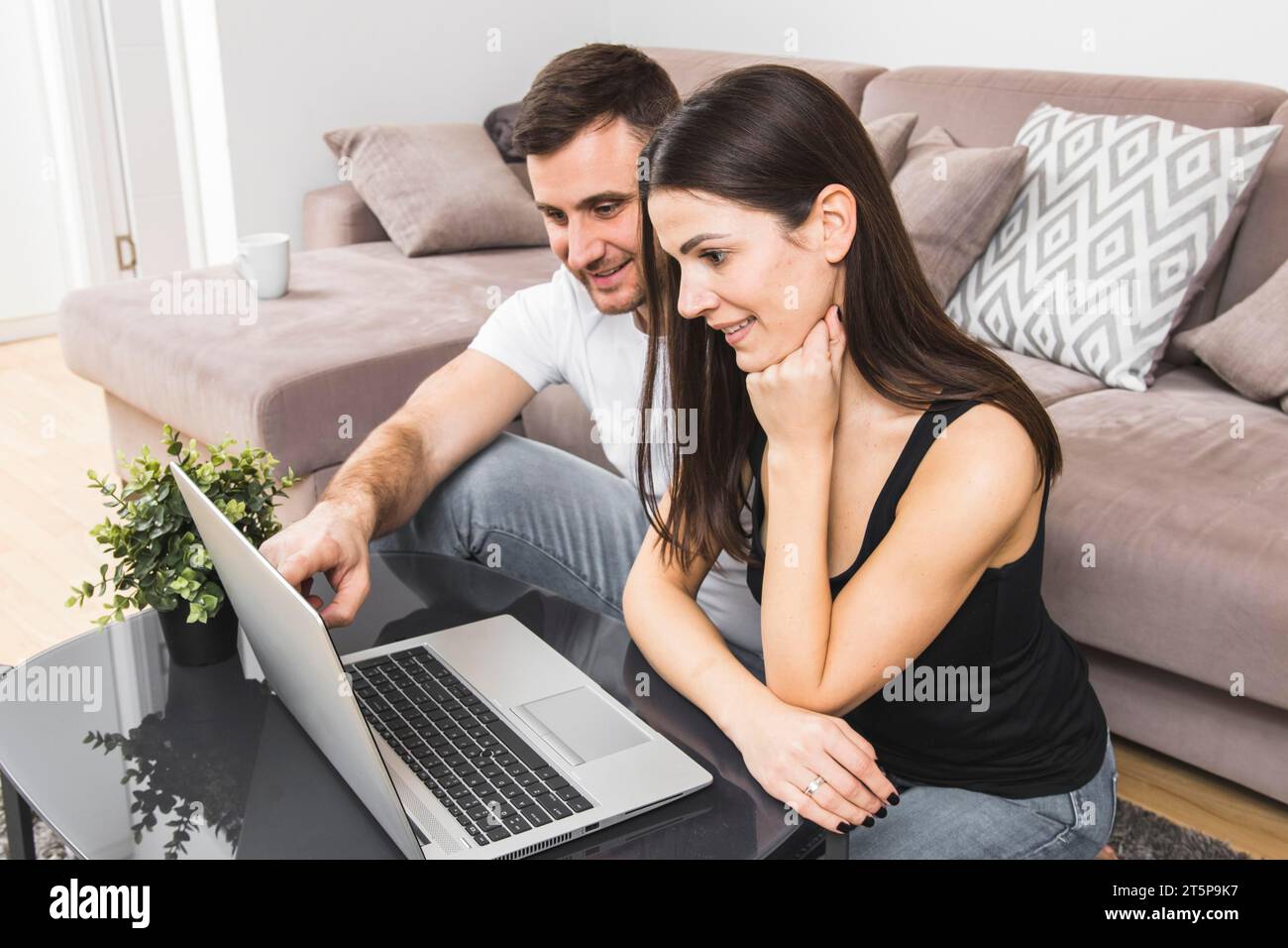 Young couple home laptop hi-res stock photography and images - Alamy