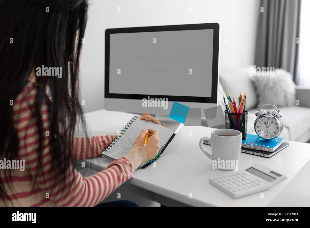Student writing notebook close up Stock Photo - Alamy