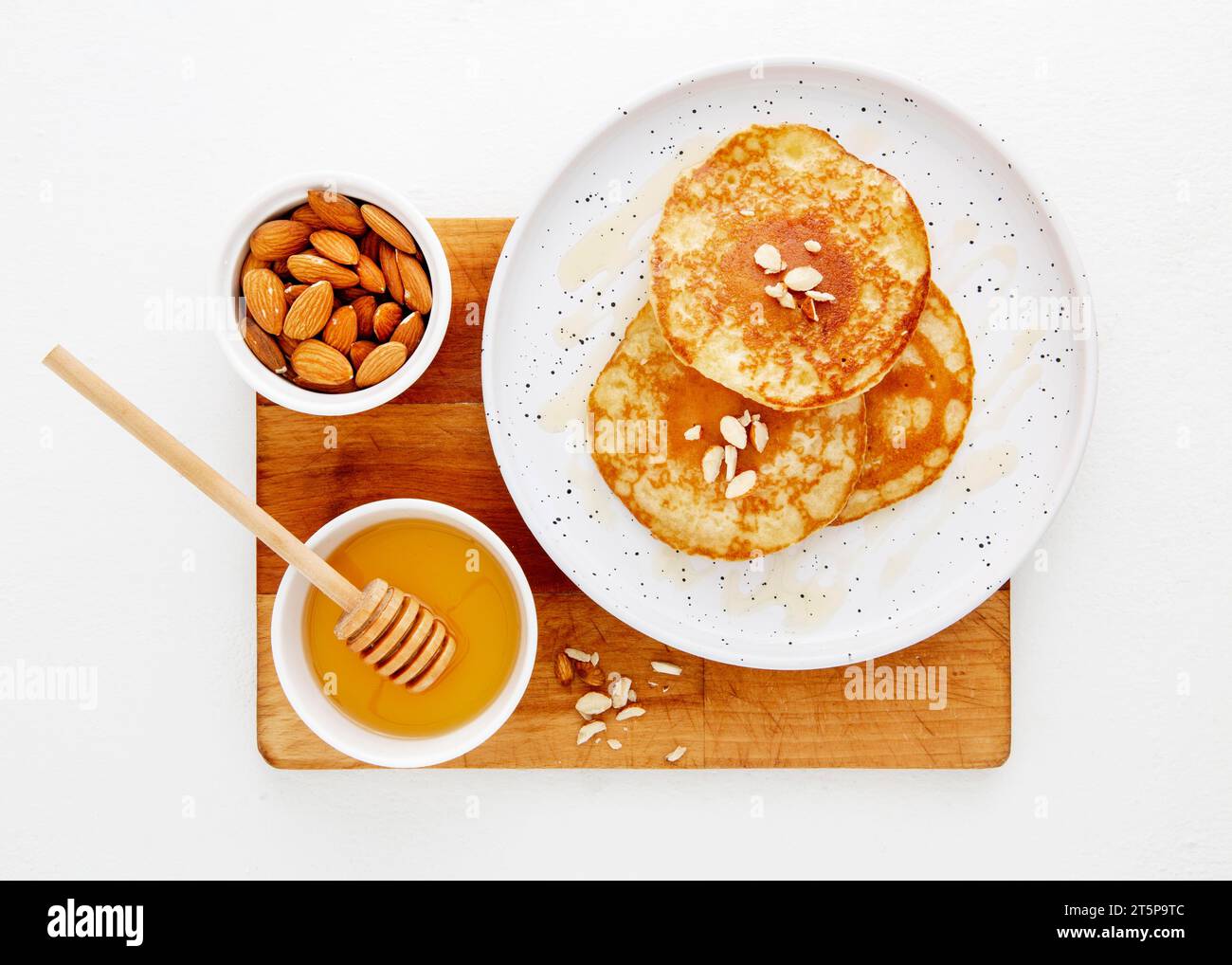 Top view delicious crepes with honey nuts Stock Photo - Alamy