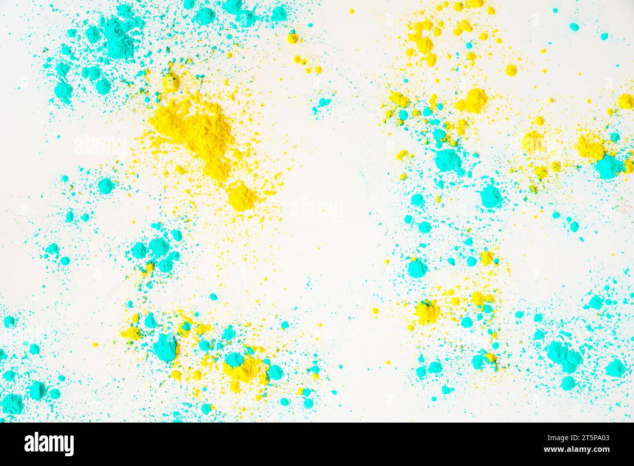 Turquoise yellow color powder white background Stock Photo - Alamy
