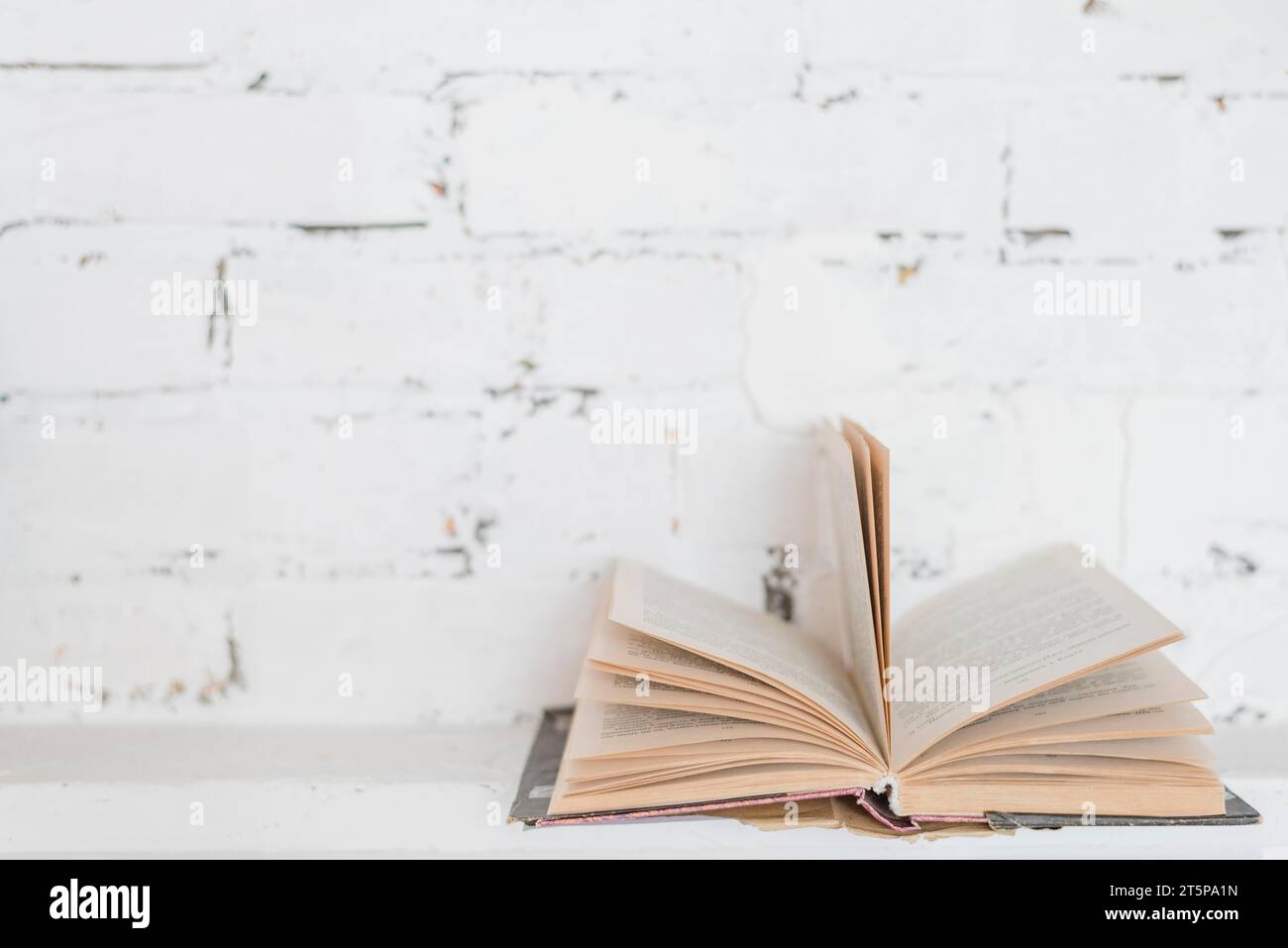 Turning pages in white book hi-res stock photography and images - Alamy