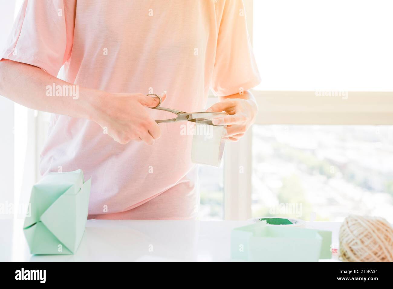 Woman hand cutting sticky tape with scissor wrapping gift box Stock ...