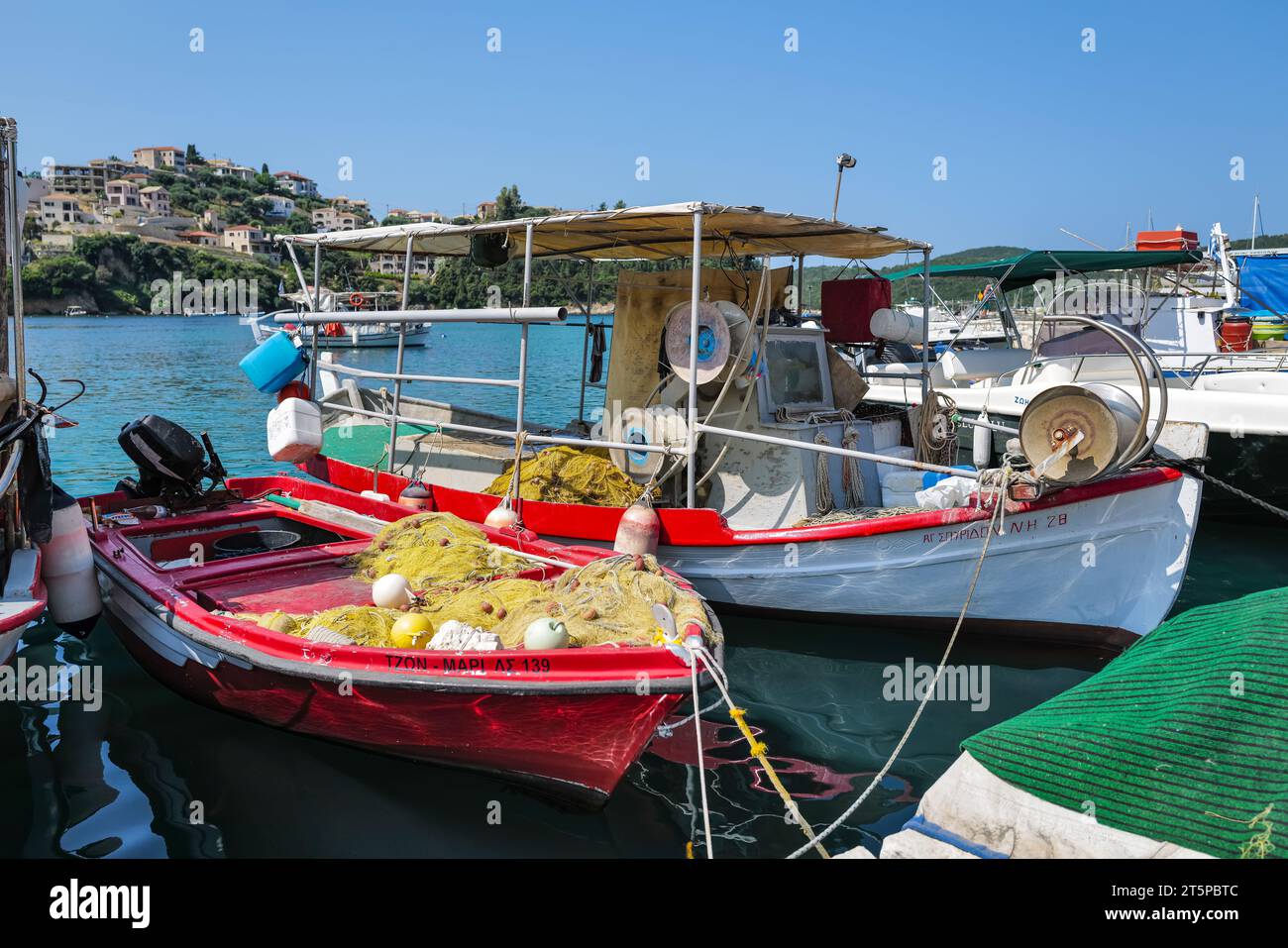 Traditional Greek fishing boats in Sivota harbour Stock Photo - Alamy