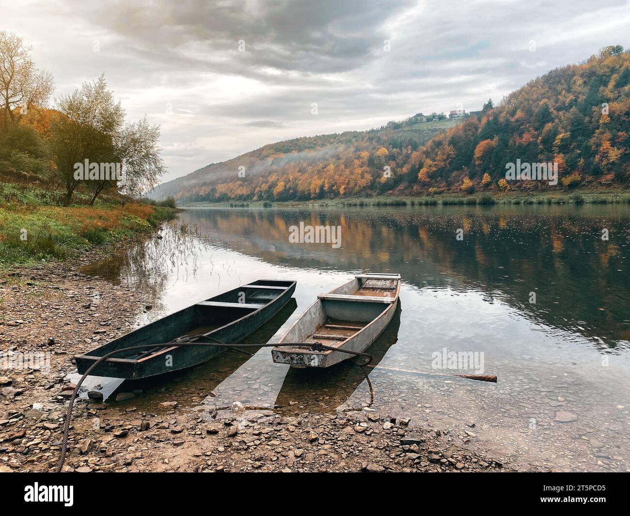 Incredible natural landscape with river, forest, boats. Wooden boats on ...