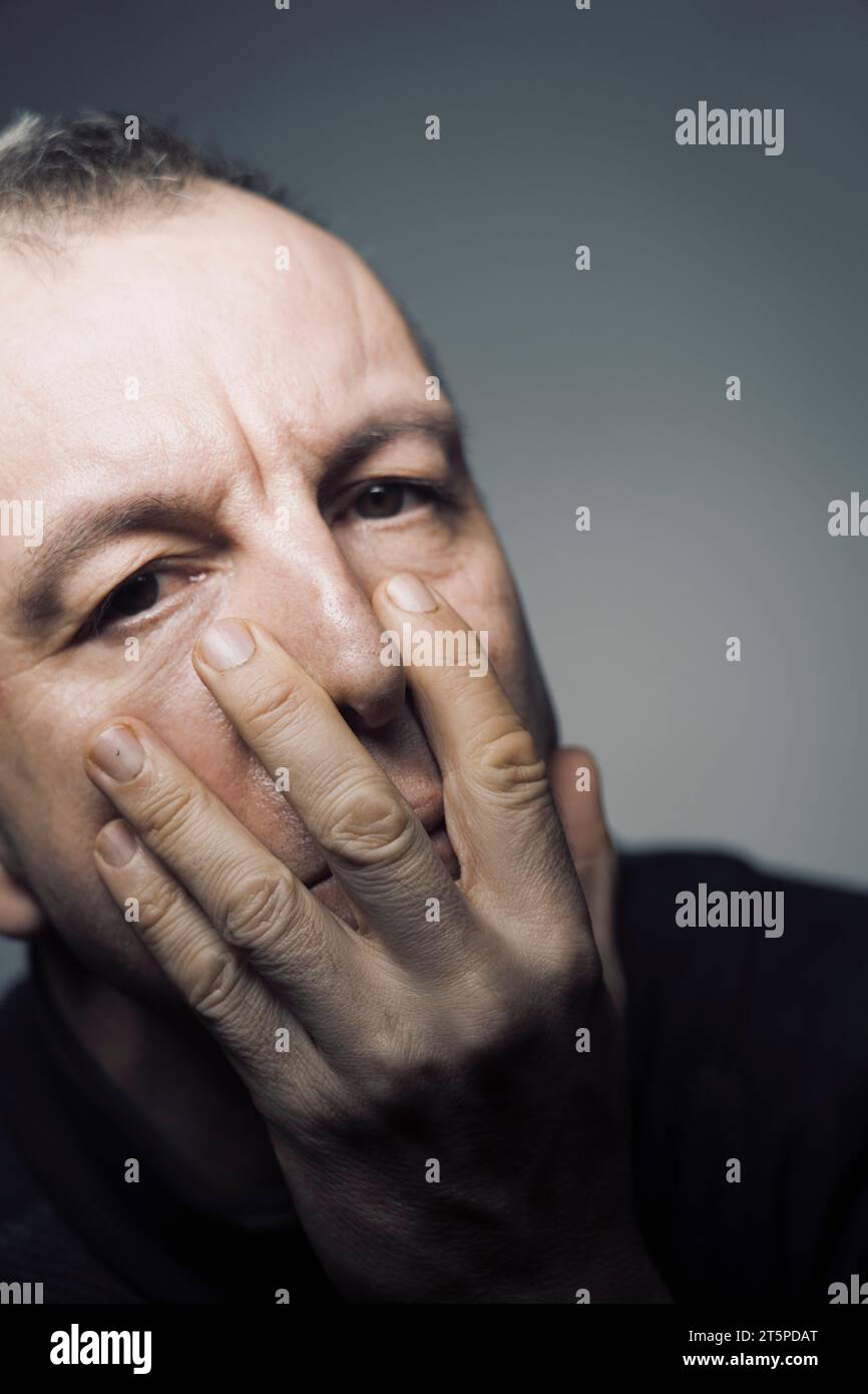 Man 50s closeup face stress feelings emotions studio shot book cover ...