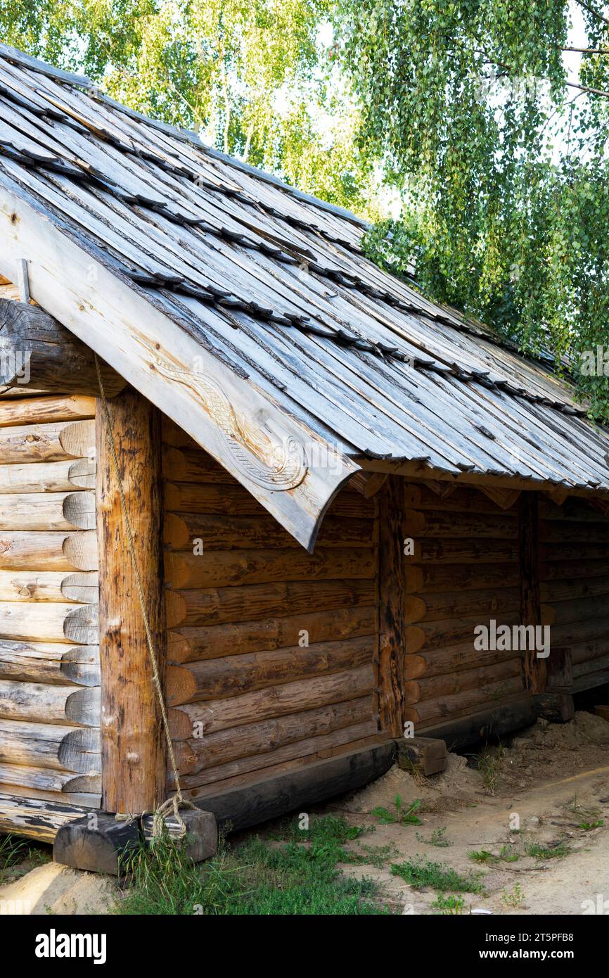 Wooden log house wall made of logs. Log house background Stock Photo ...