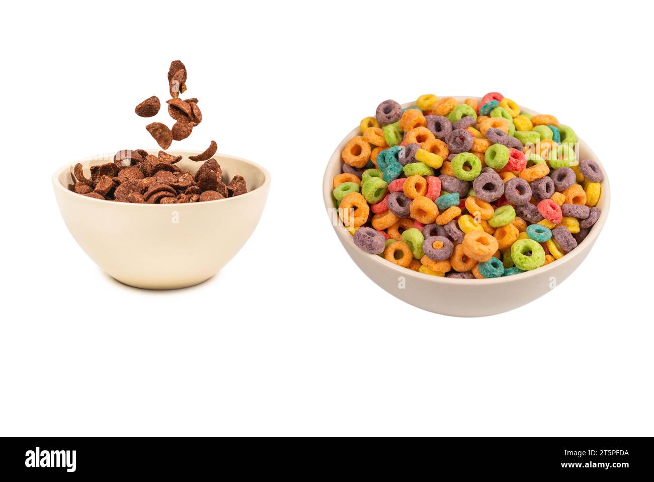 Colorful rings cereal spill out into a bowl. Breakfast. Isolated on a ...