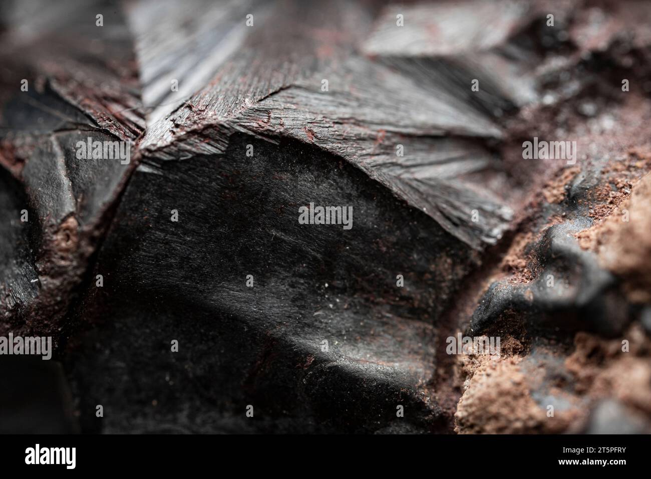 Metal rock texture. Close up of a raw hematite stone. Shiny mineral ...